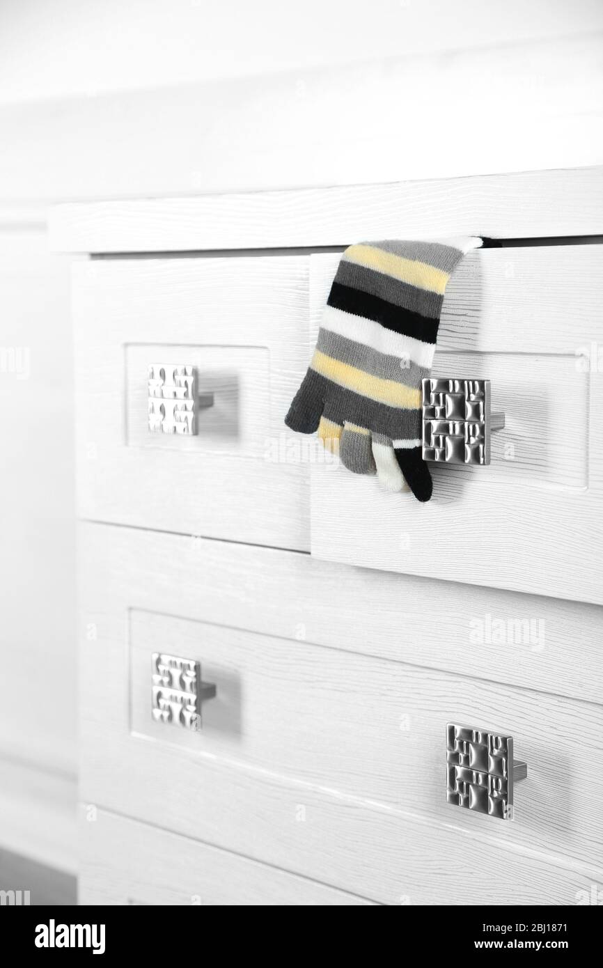 White wooden chest of drawer with sock in opened drawer Stock Photo - Alamy