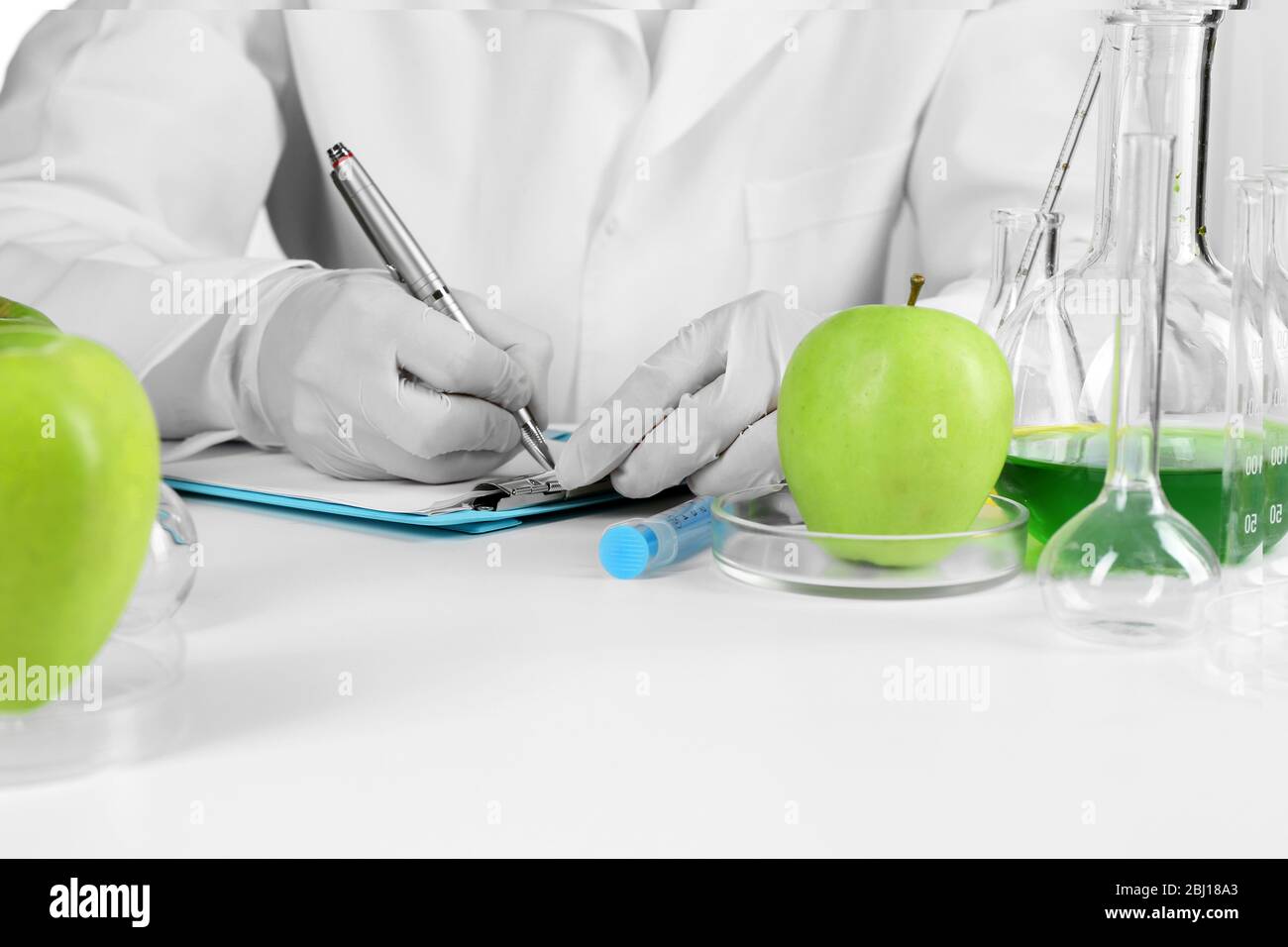 Scientist examines apples in laboratory Stock Photo - Alamy