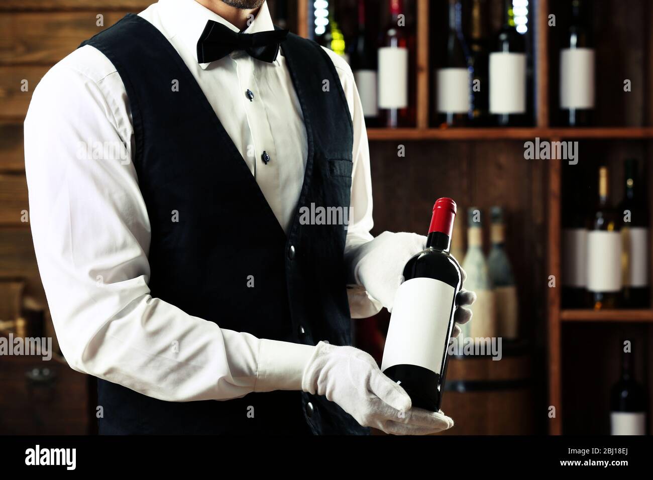 Bartender working on bar background Stock Photo - Alamy