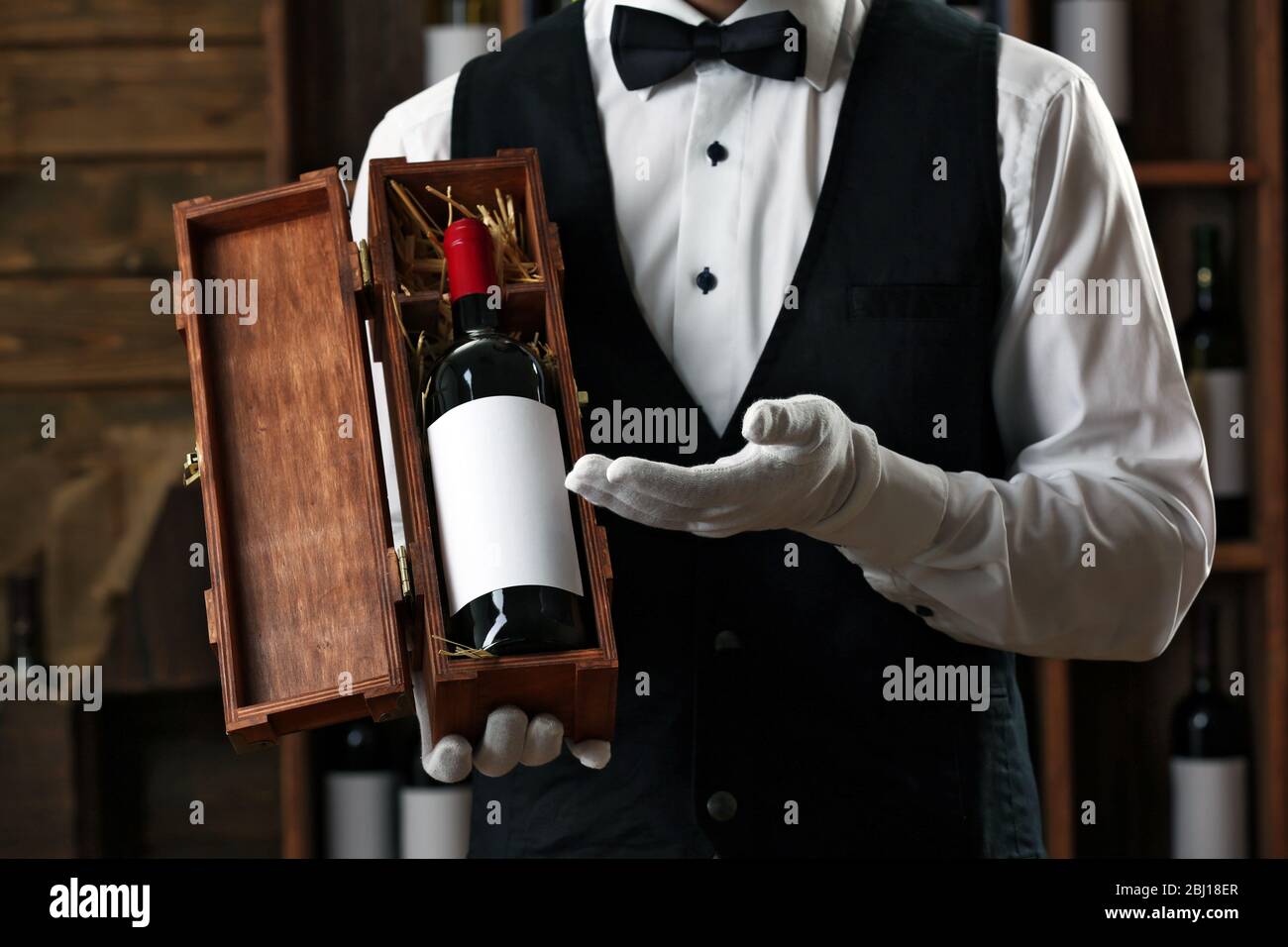 Bartender working on bar background Stock Photo - Alamy