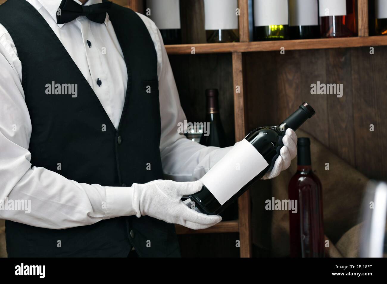 Bartender working on bar background Stock Photo - Alamy