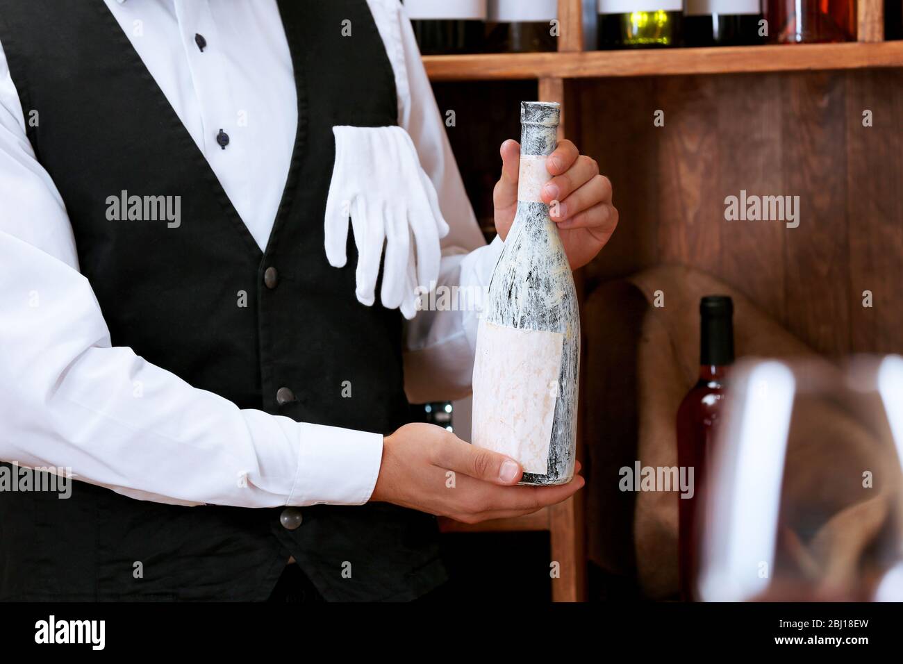Bartender working on bar background Stock Photo - Alamy