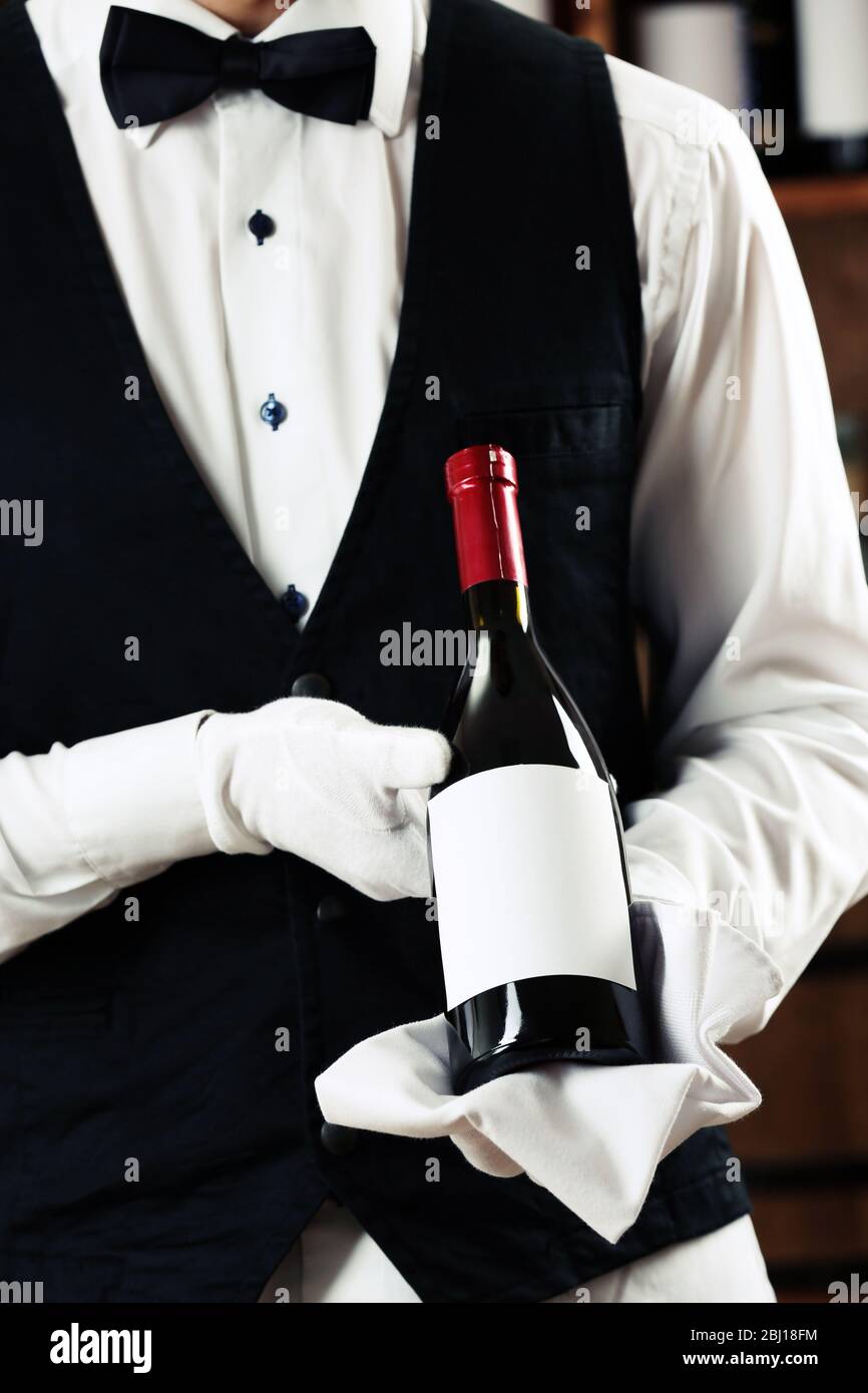 Bartender working on bar background Stock Photo - Alamy
