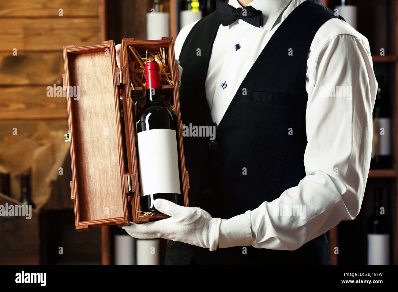 Bartender working on bar background Stock Photo - Alamy