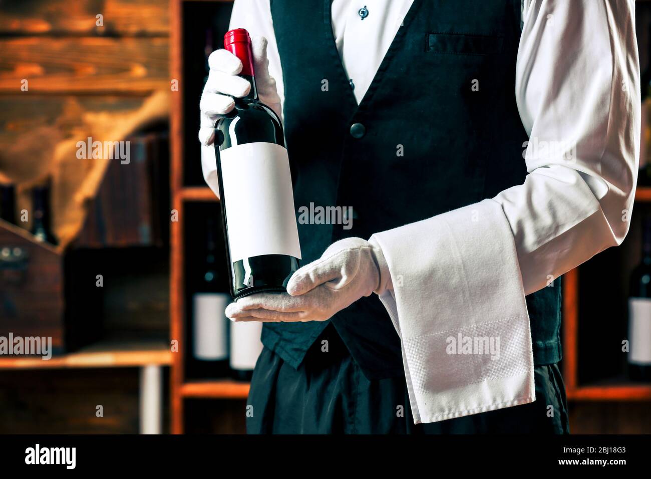 Bartender working on bar background Stock Photo - Alamy