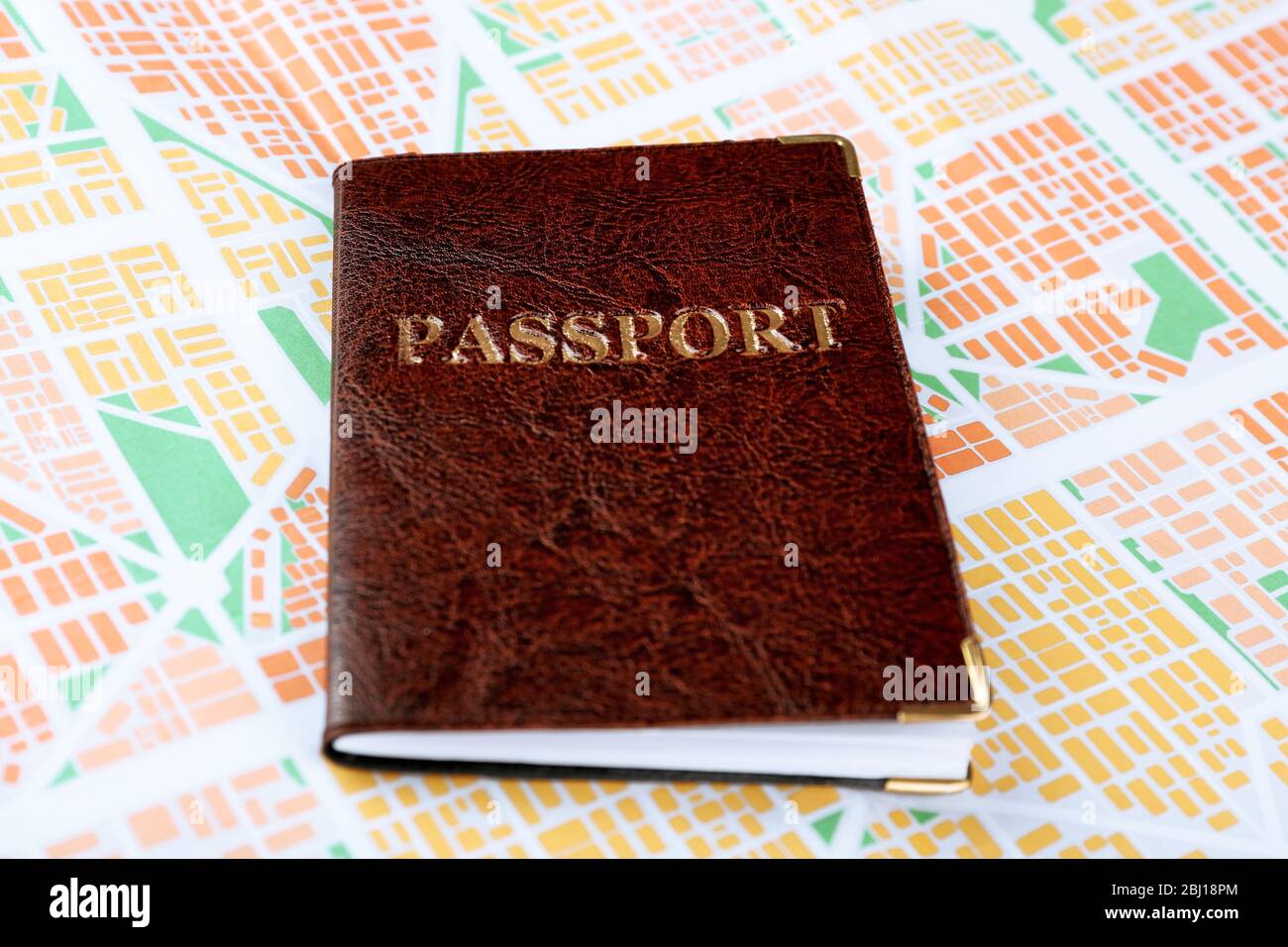 Passport on map background Stock Photo - Alamy