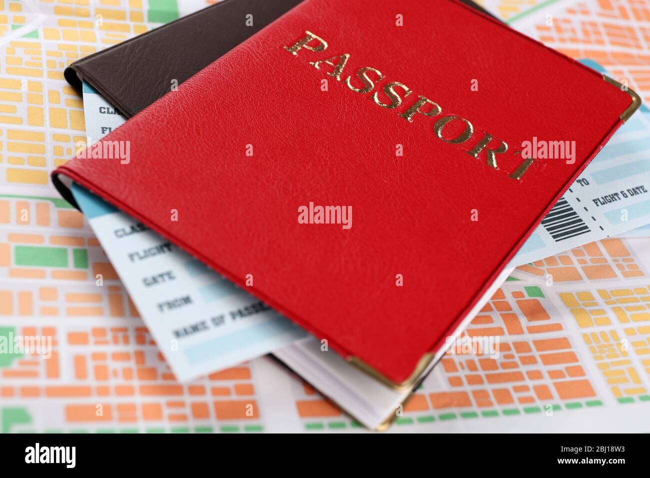 Passports with tickets on map background Stock Photo - Alamy