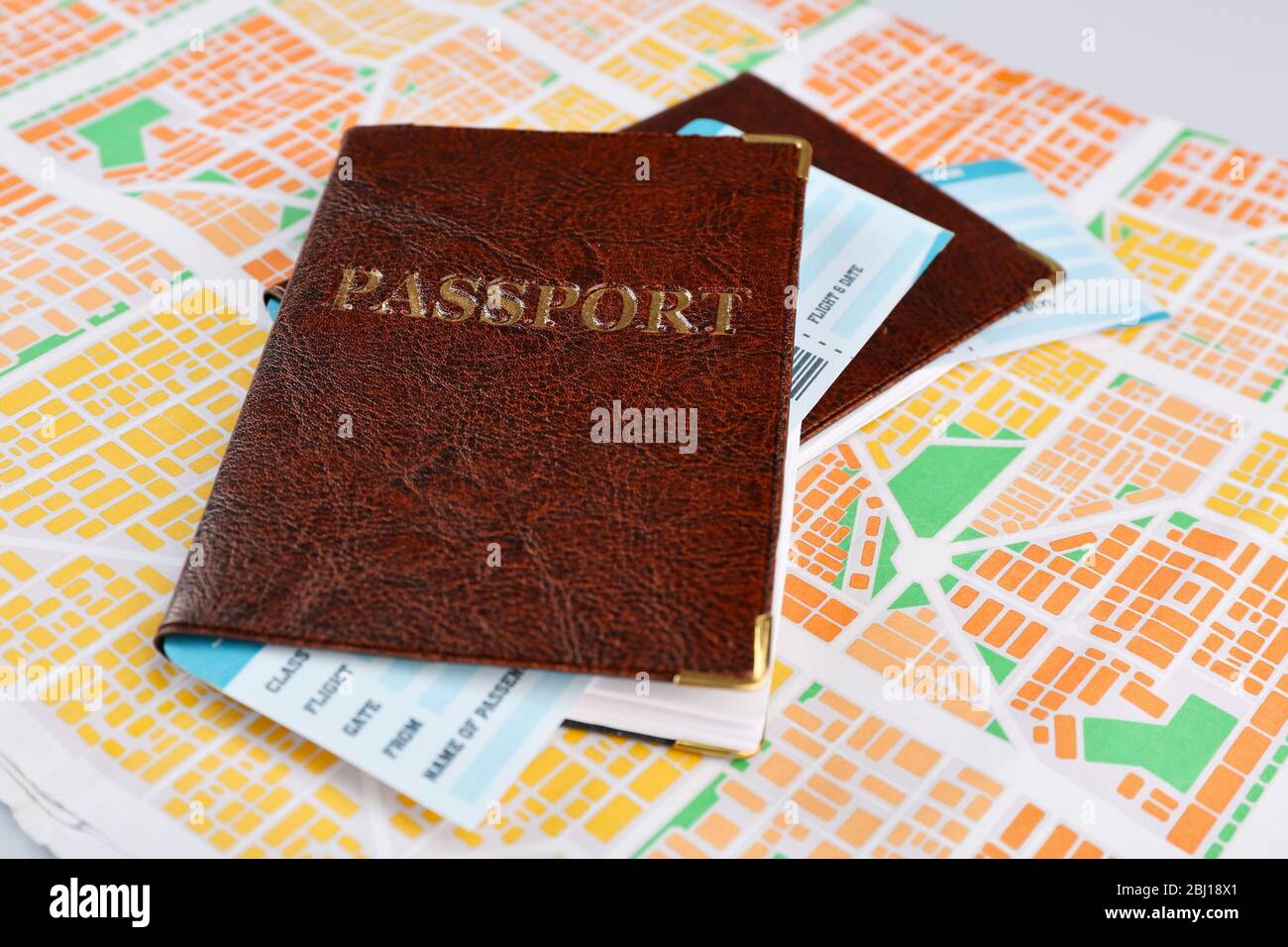Passports with tickets on map background Stock Photo - Alamy