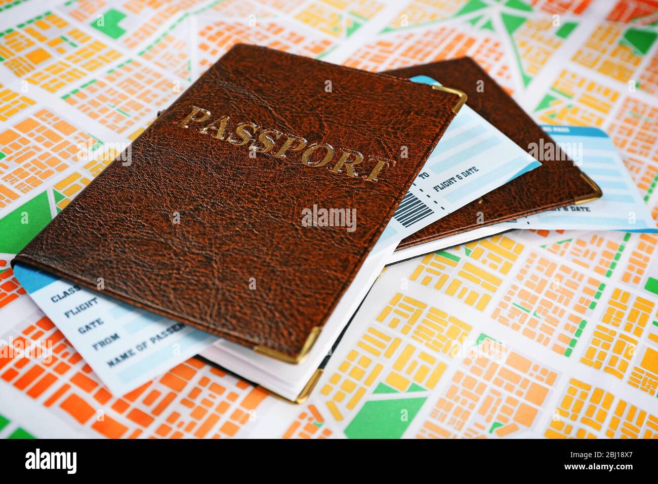 Passports with tickets on map background Stock Photo - Alamy
