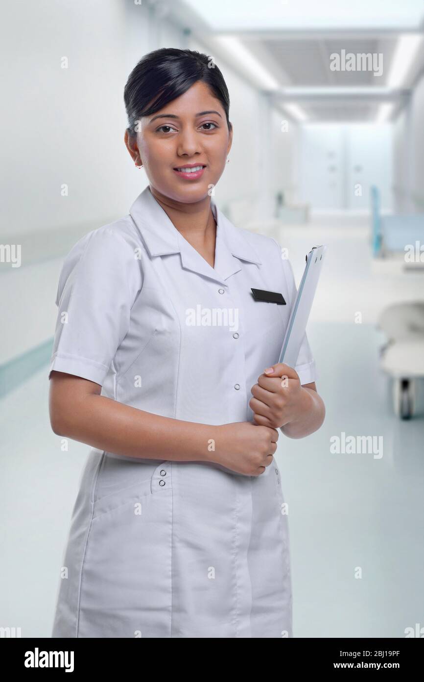 Portrait of a nurse with a clipboard in hospital Stock Photo - Alamy