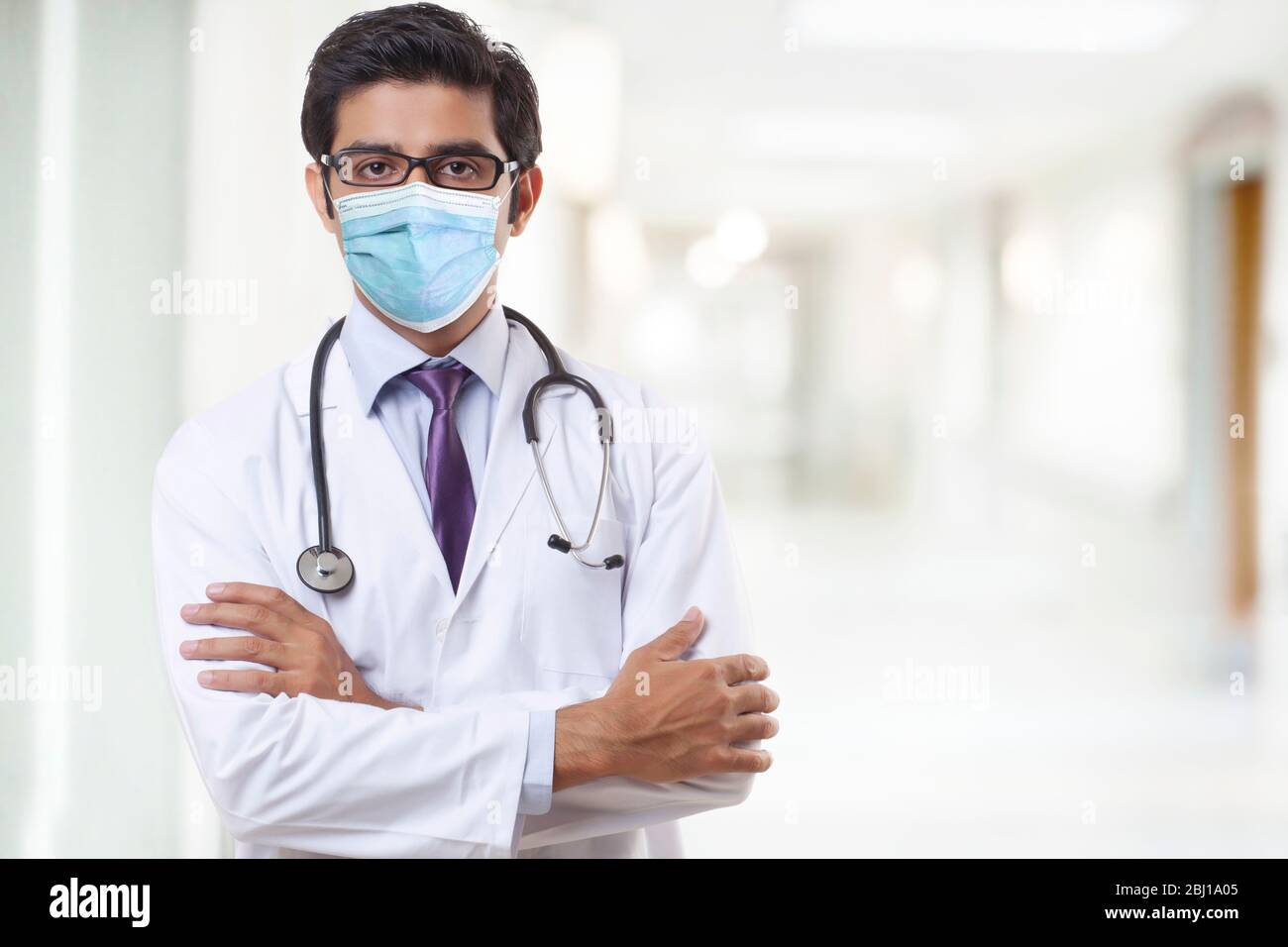Doctor with stethoscope around neck on hospital Stock Photo - Alamy