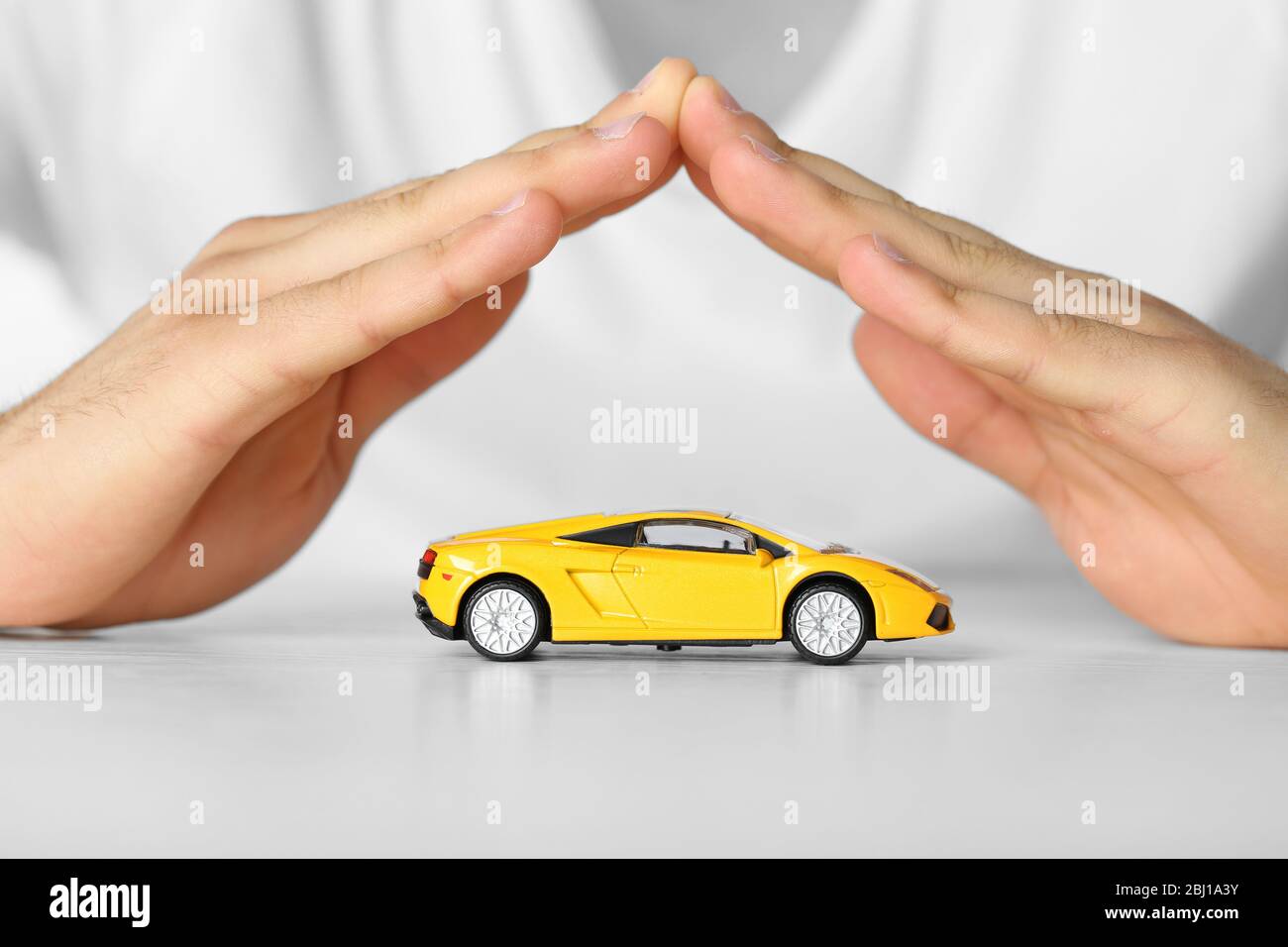 Male hands and car as protection of car concept Stock Photo - Alamy
