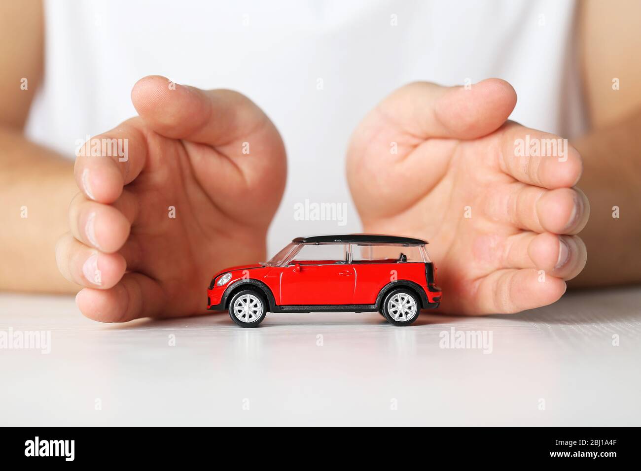 Male hands and car as protection of car concept Stock Photo - Alamy