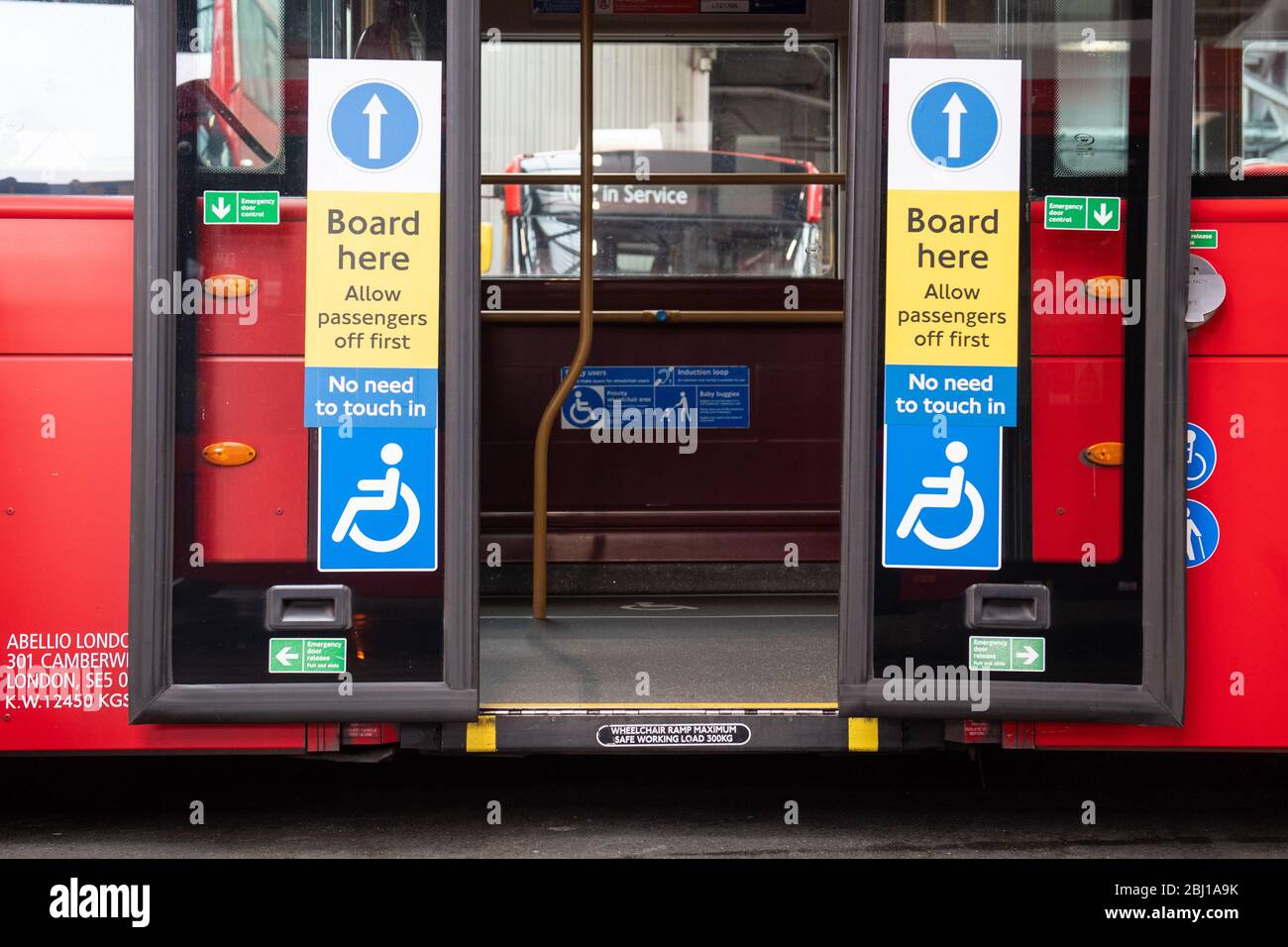 General view of signage telling bus passengers to board by the middle ...