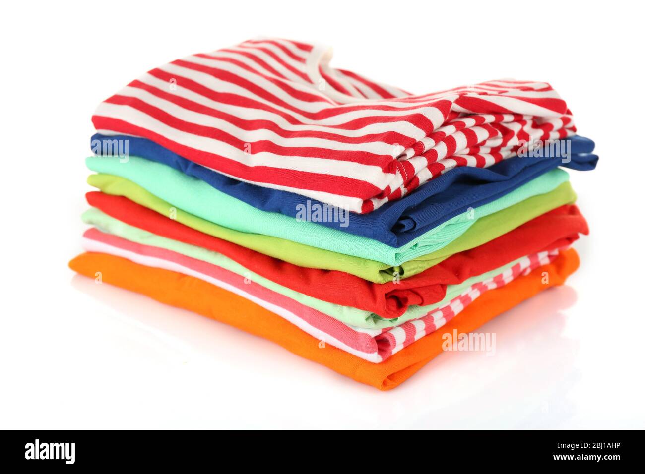 Stack of colorful clothing isolated on white Stock Photo - Alamy