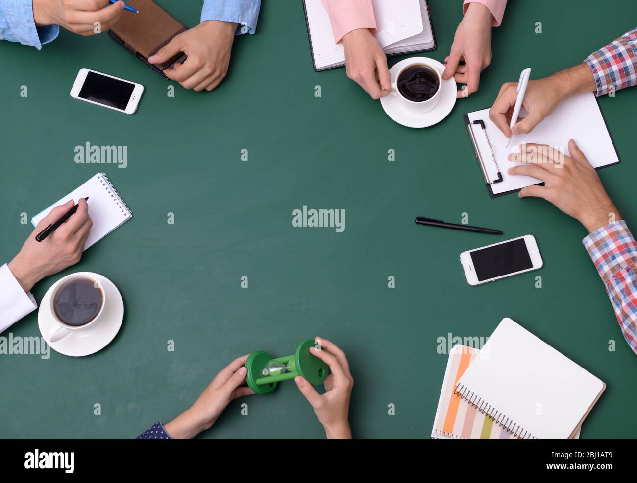 Top view of people hands at working process Stock Photo - Alamy