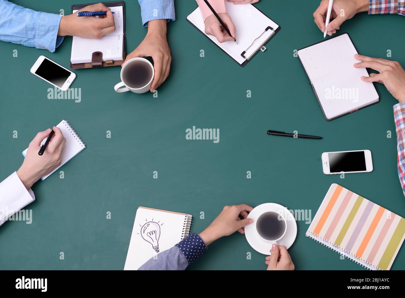 Top view of people hands at working process Stock Photo - Alamy