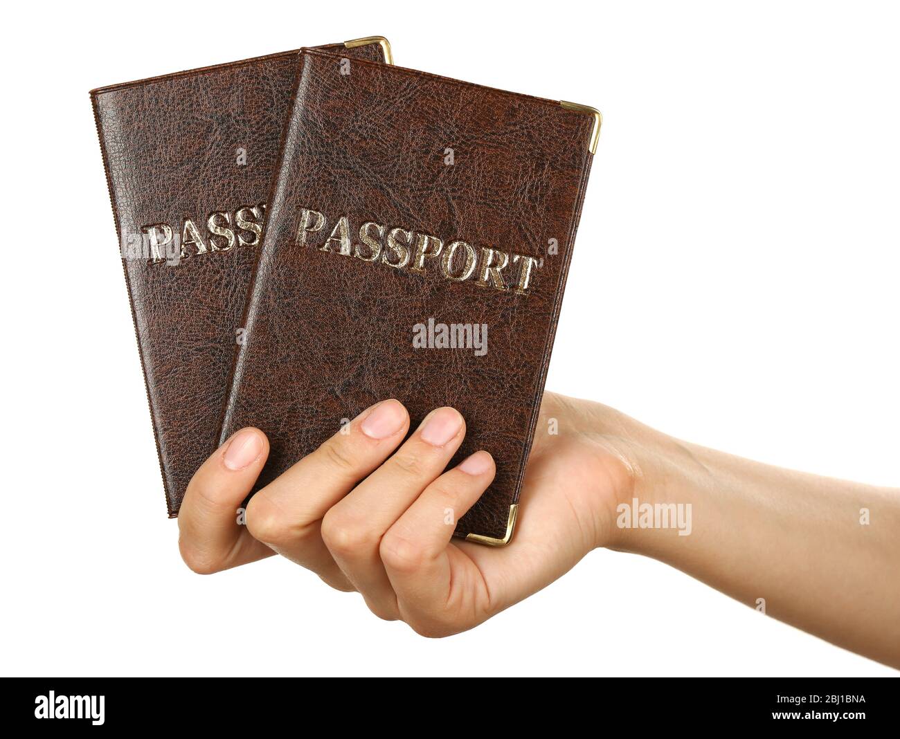 Female hand holding passports isolated on white Stock Photo - Alamy