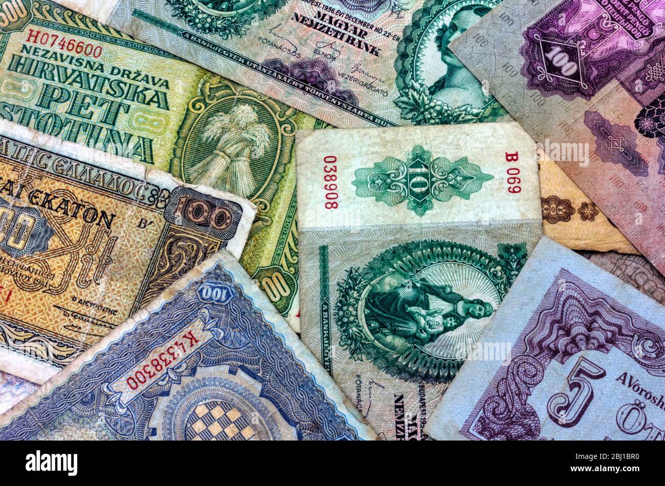 A background of old used banknotes from European countries from the ...