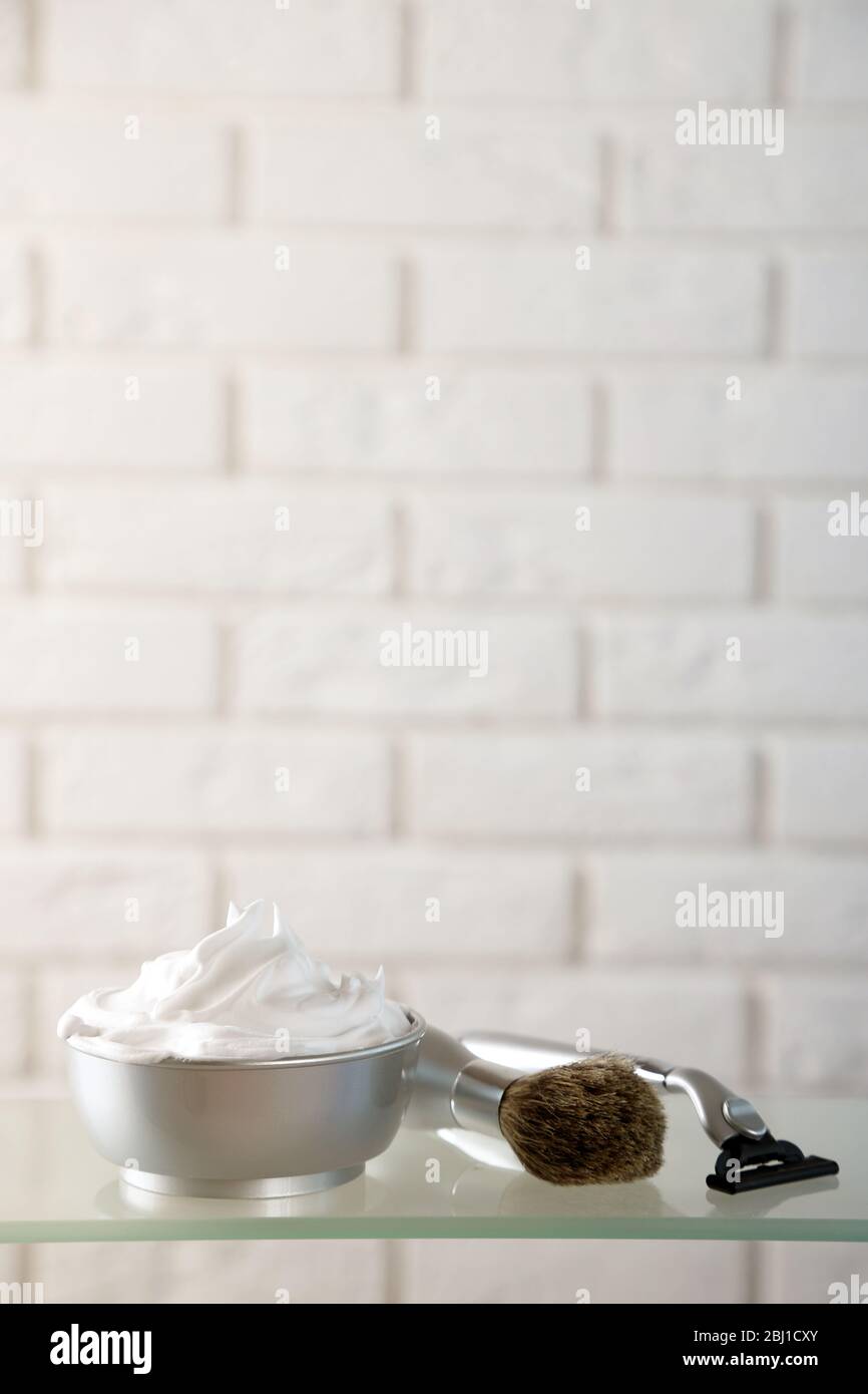 Male luxury shaving kit on shelf, on bricks wall background Stock Photo ...