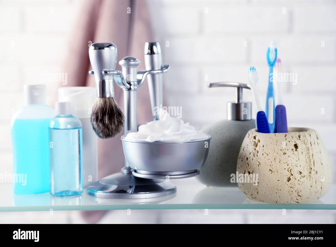 Male luxury shaving kit on shelf, on bricks wall background Stock Photo ...