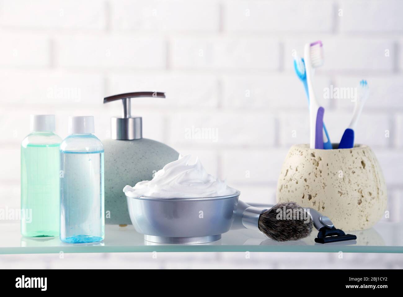 Male luxury shaving kit on shelf, on bricks wall background Stock Photo ...