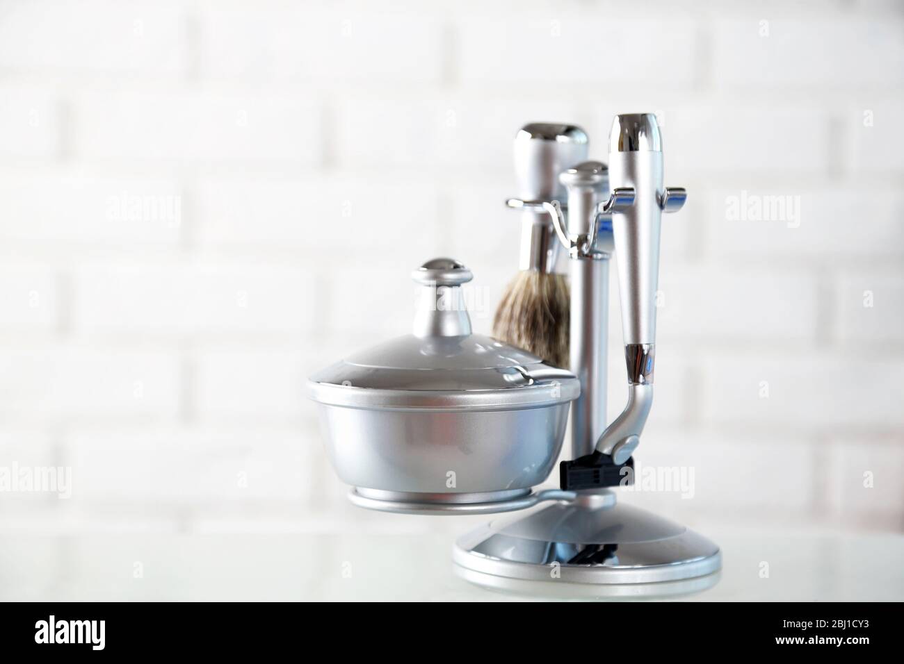 Male luxury shaving kit on shelf, on bricks wall background Stock Photo ...