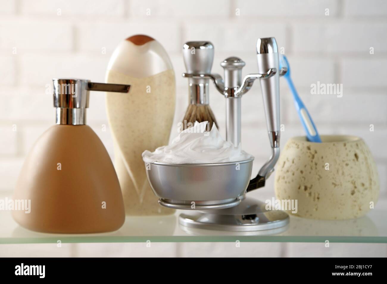 Male luxury shaving kit on shelf, on bricks wall background Stock Photo ...