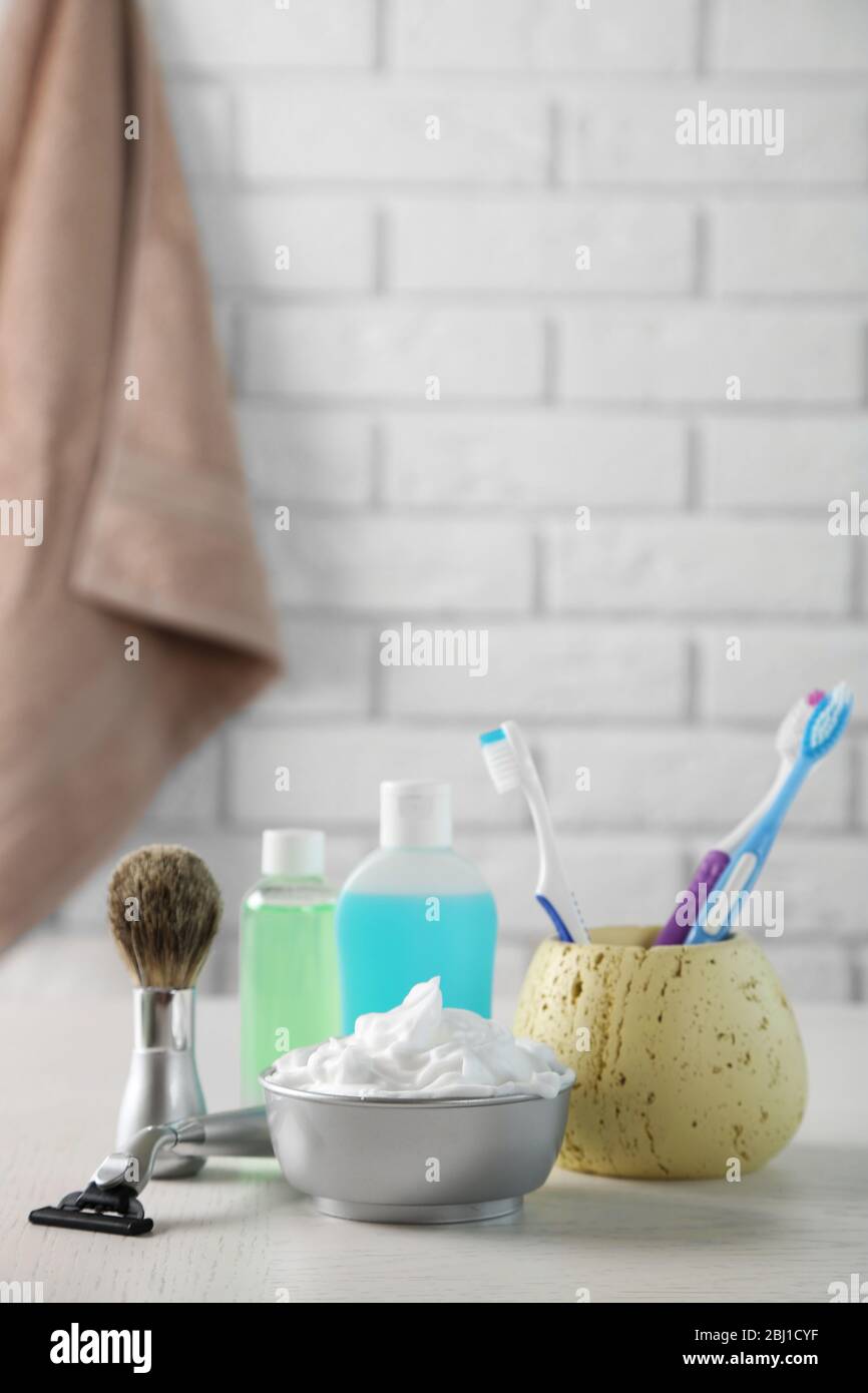 Male luxury shaving kit on shelf, on bricks wall background Stock Photo ...