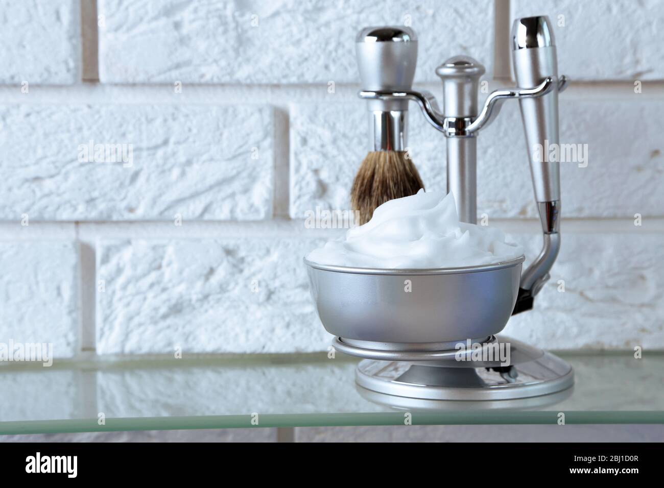 Male luxury shaving kit on shelf, on bricks wall background Stock Photo ...