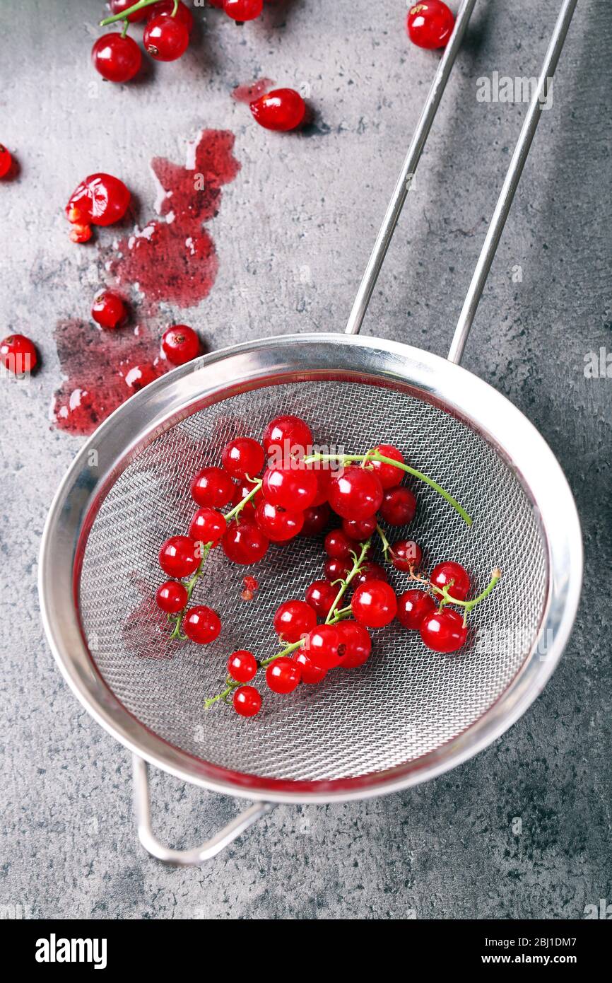 Berries in sieve hi-res stock photography and images - Alamy
