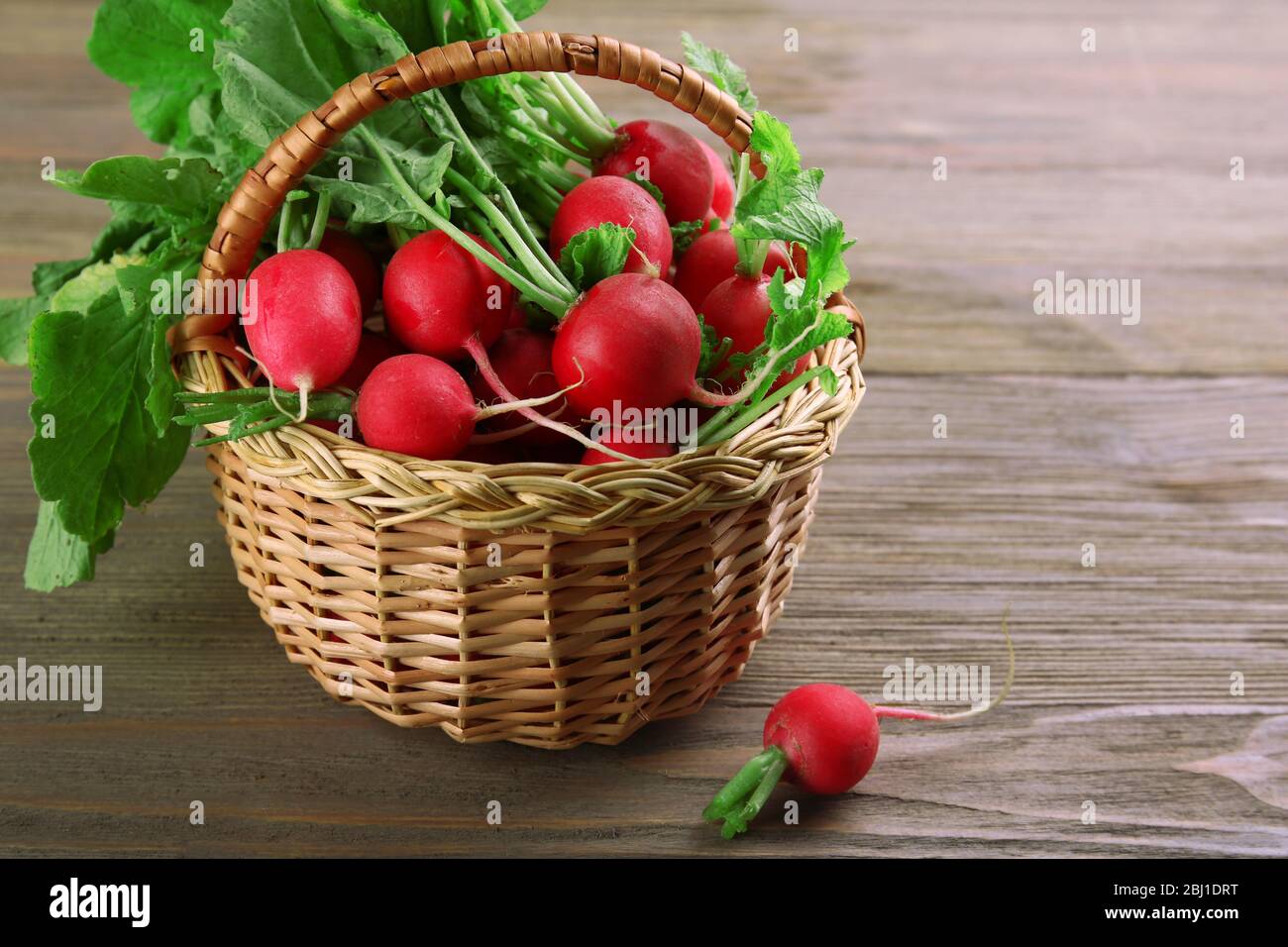 Fresh radishes in basket hi-res stock photography and images - Alamy