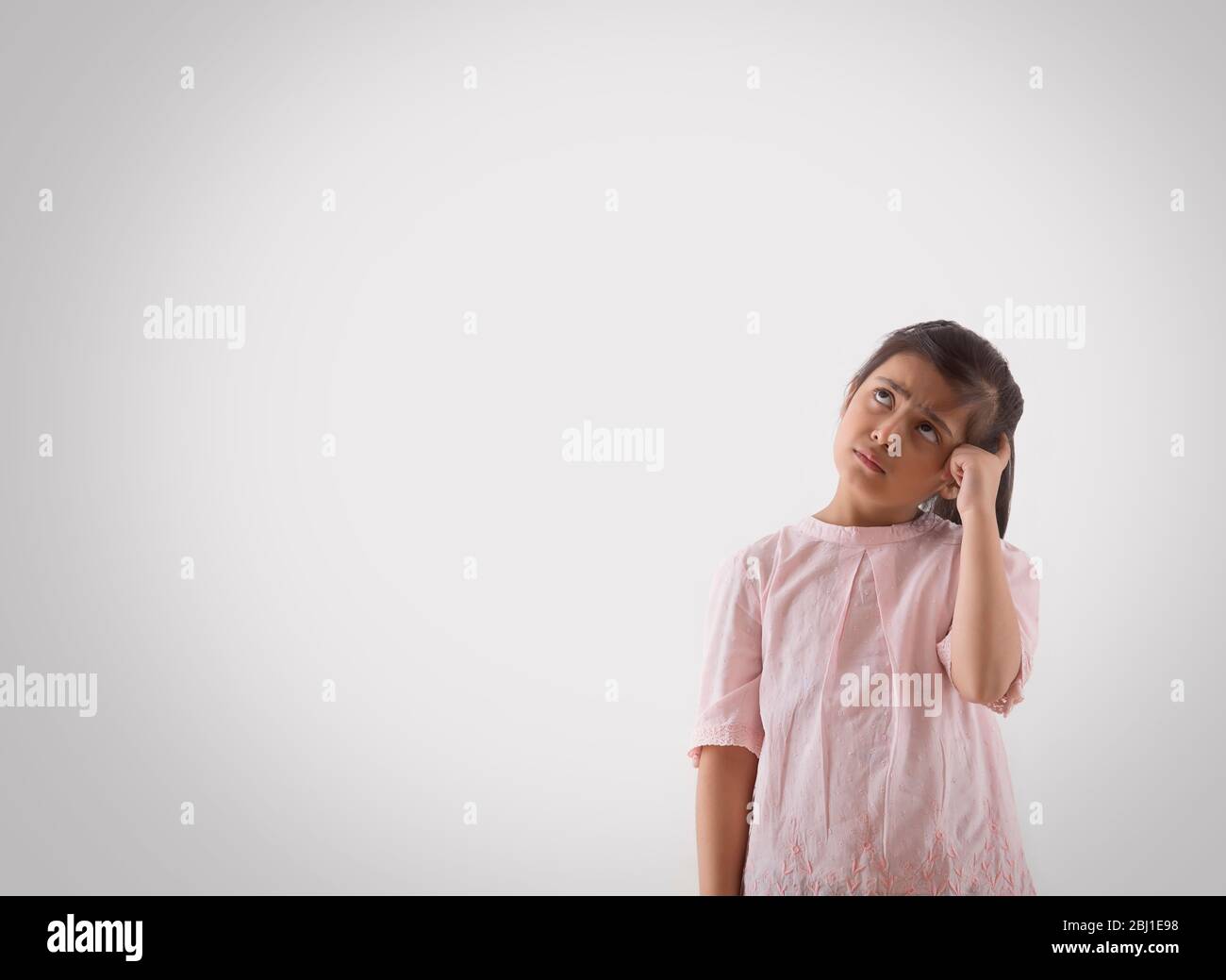 portrait of a young girl thinking Stock Photo - Alamy