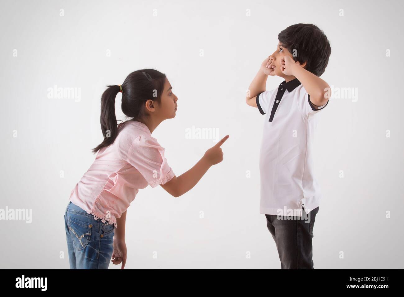 young sister scolding her brother Stock Photo - Alamy