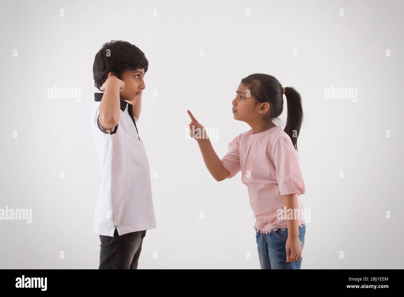 young sister scolding her brother Stock Photo - Alamy