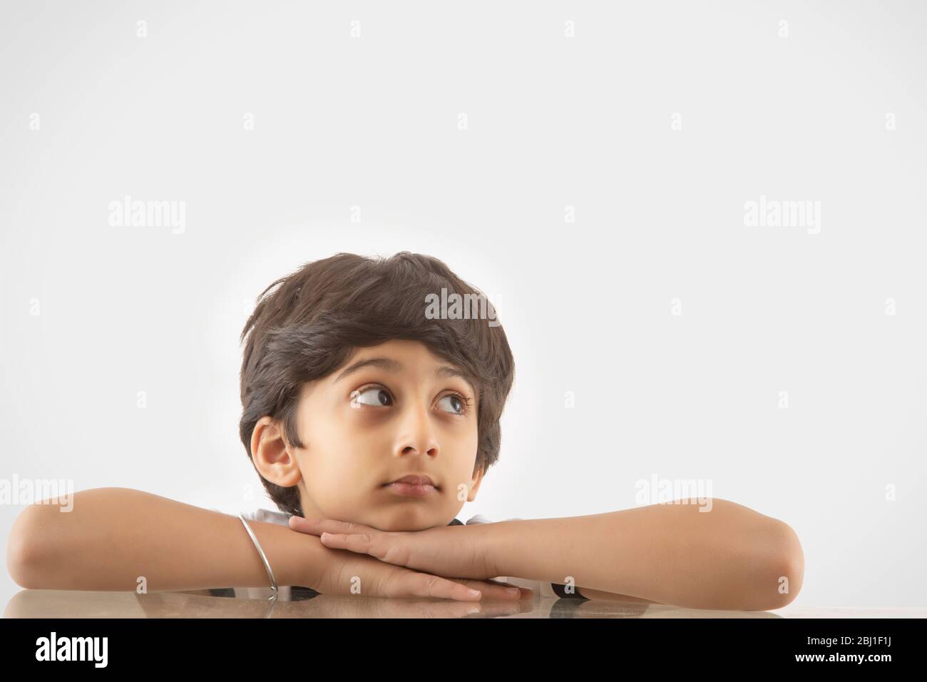 portrait of a young boy looking sideways and smiling Stock Photo - Alamy