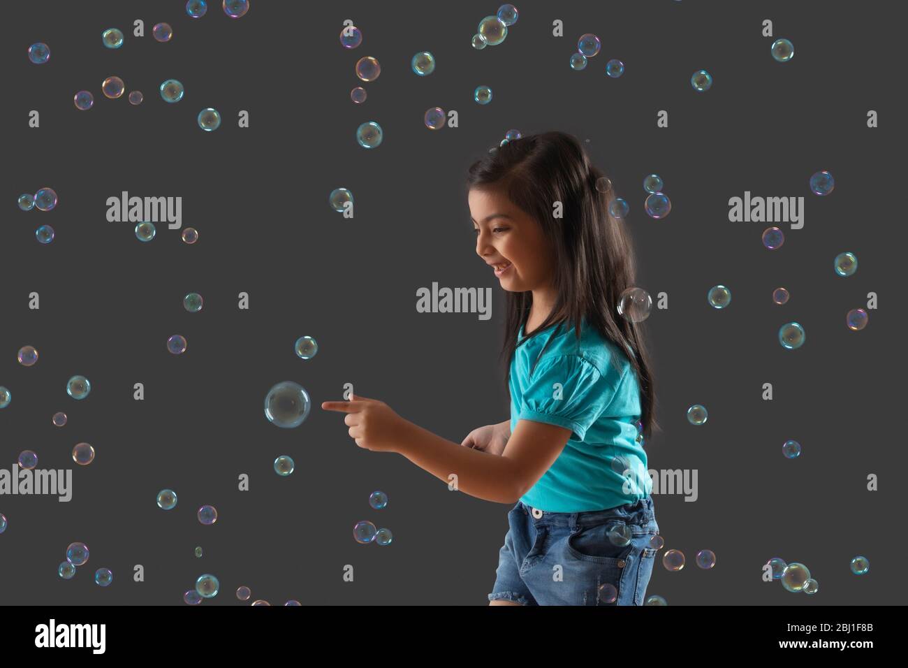 Child Popping Bubbles High Resolution Stock Photography and Images - Alamy