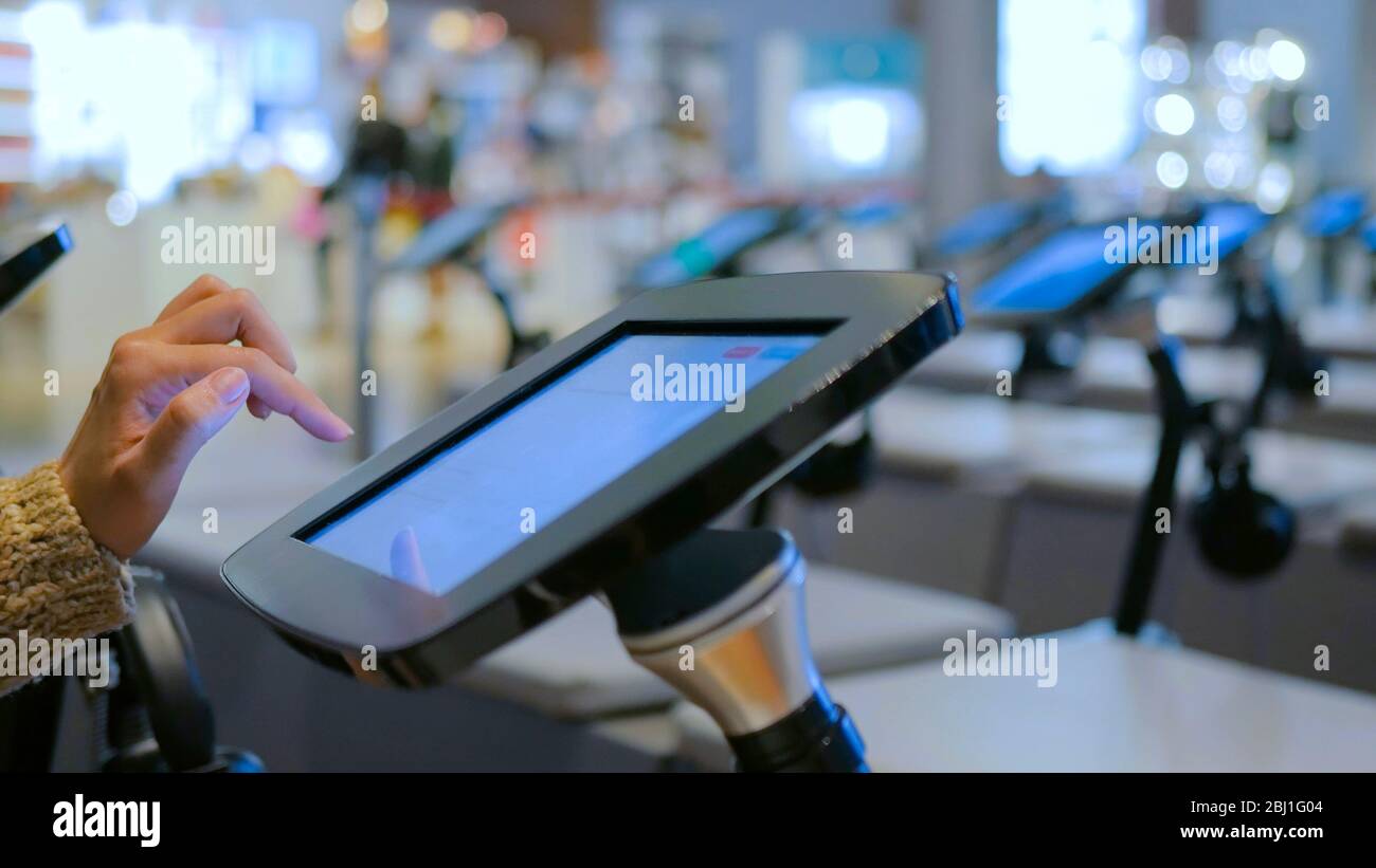 Woman using interactive touchscreen display tablet at jewish modern ...
