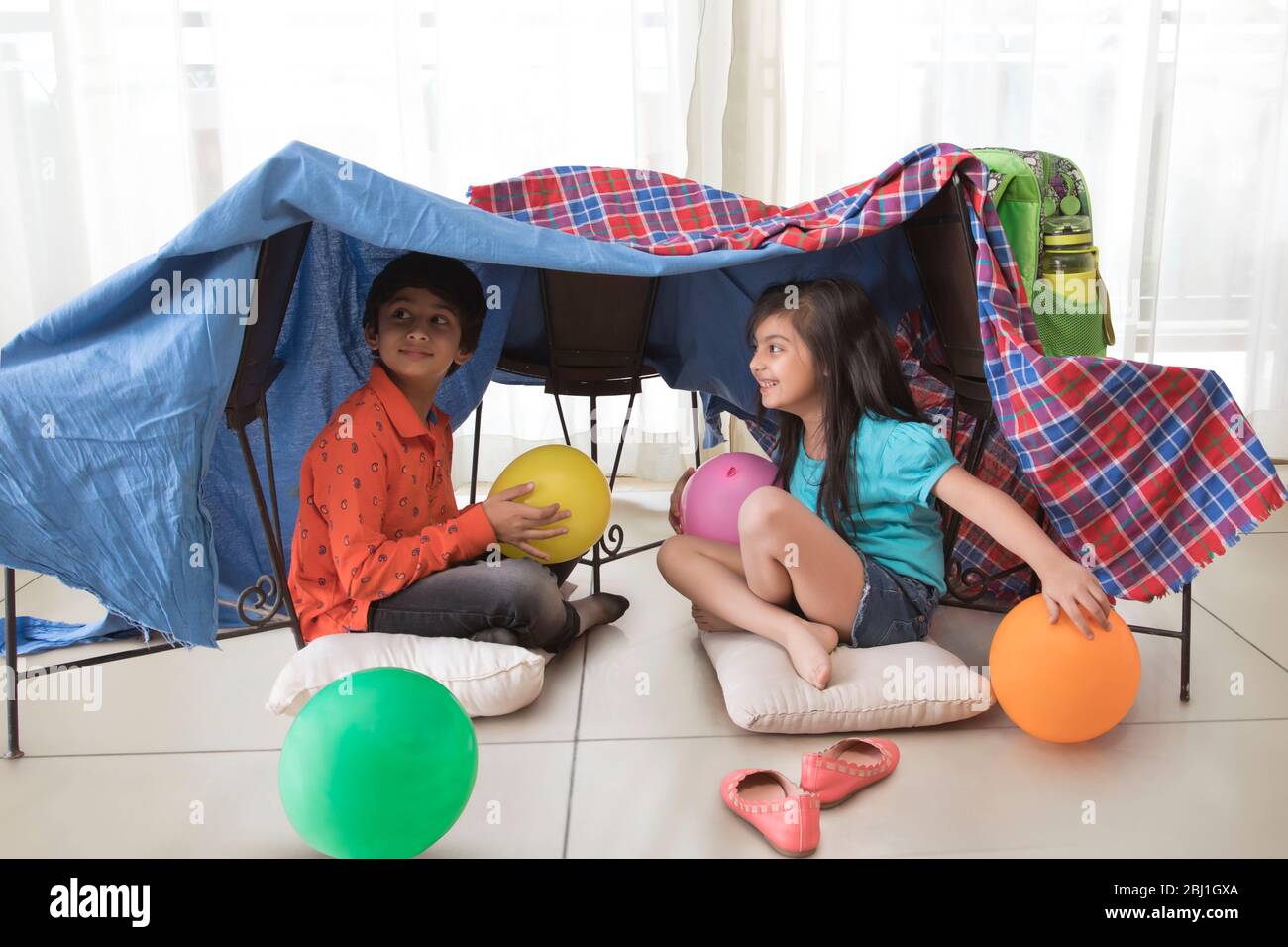brother and sister camping at home Stock Photo - Alamy