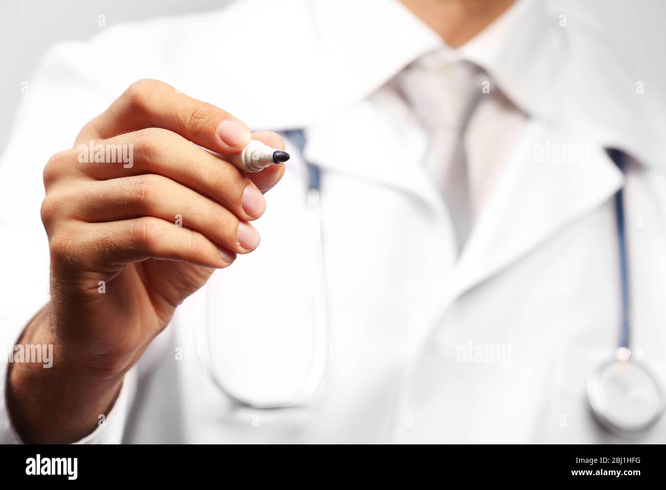 Doctor holding marker in his hand, closeup Stock Photo - Alamy