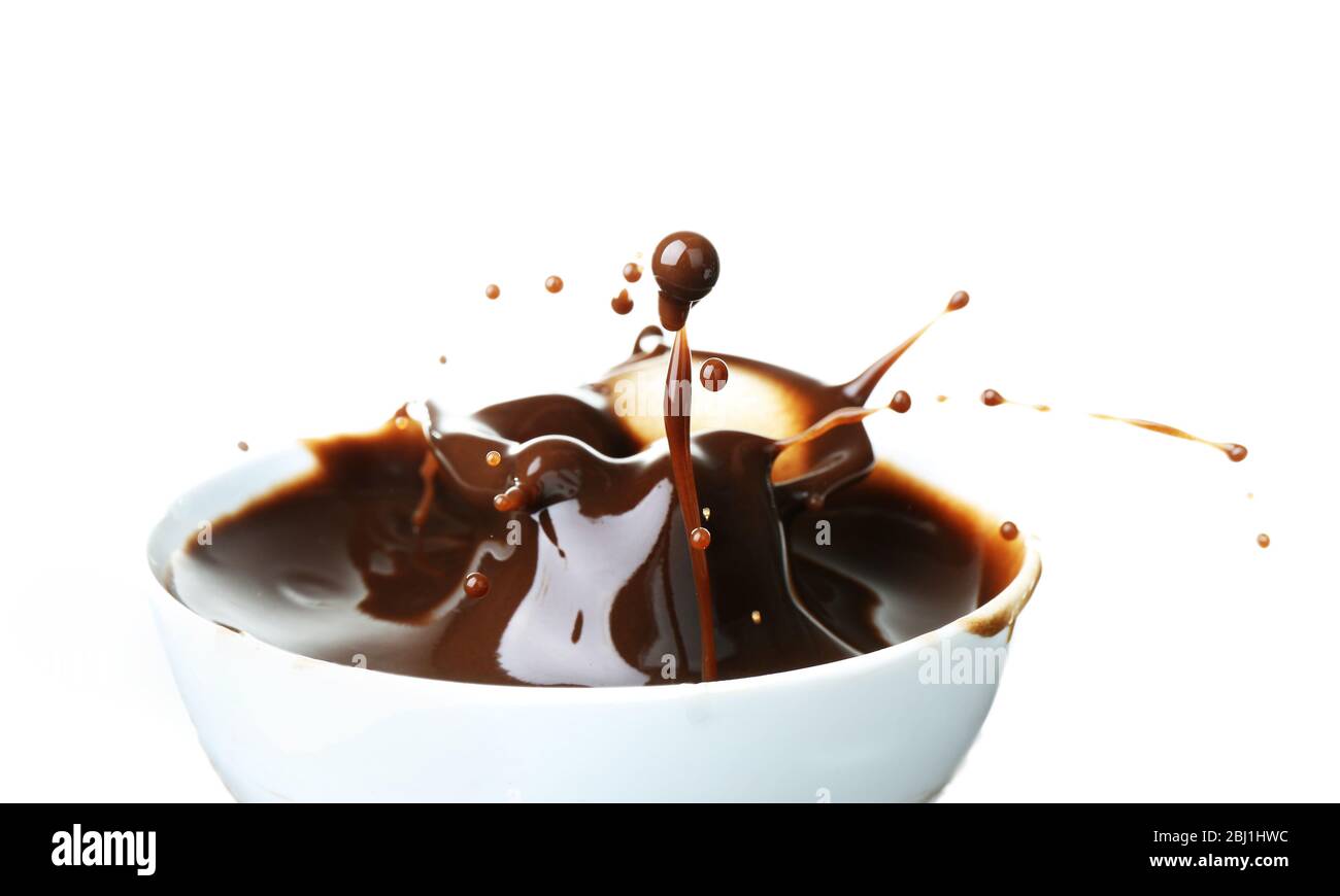Splash of hot chocolate in cup isolated on white Stock Photo - Alamy