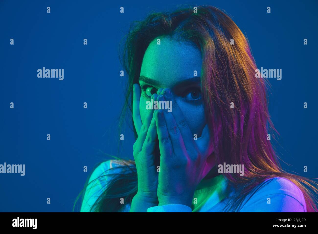 Hiding face with hands. Caucasian young woman's portrait isolated on ...