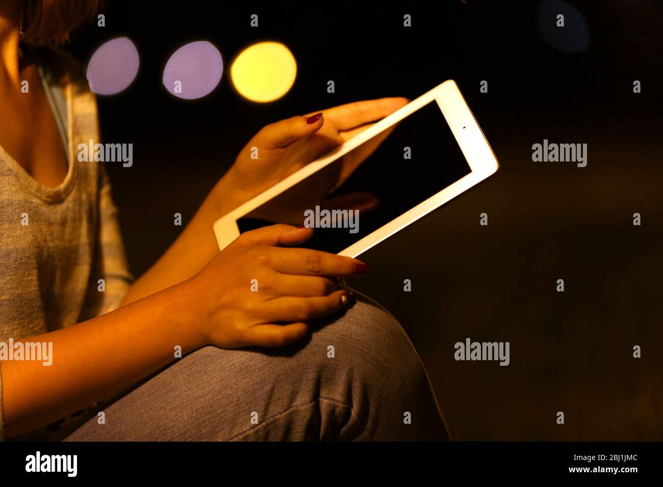 Woman connecting tablet night hi-res stock photography and images - Alamy