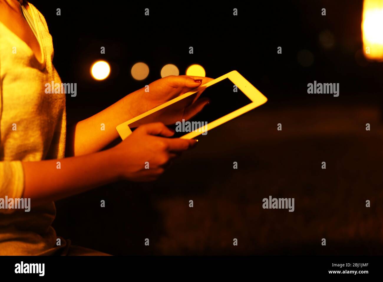 Woman connecting tablet night hi-res stock photography and images - Alamy