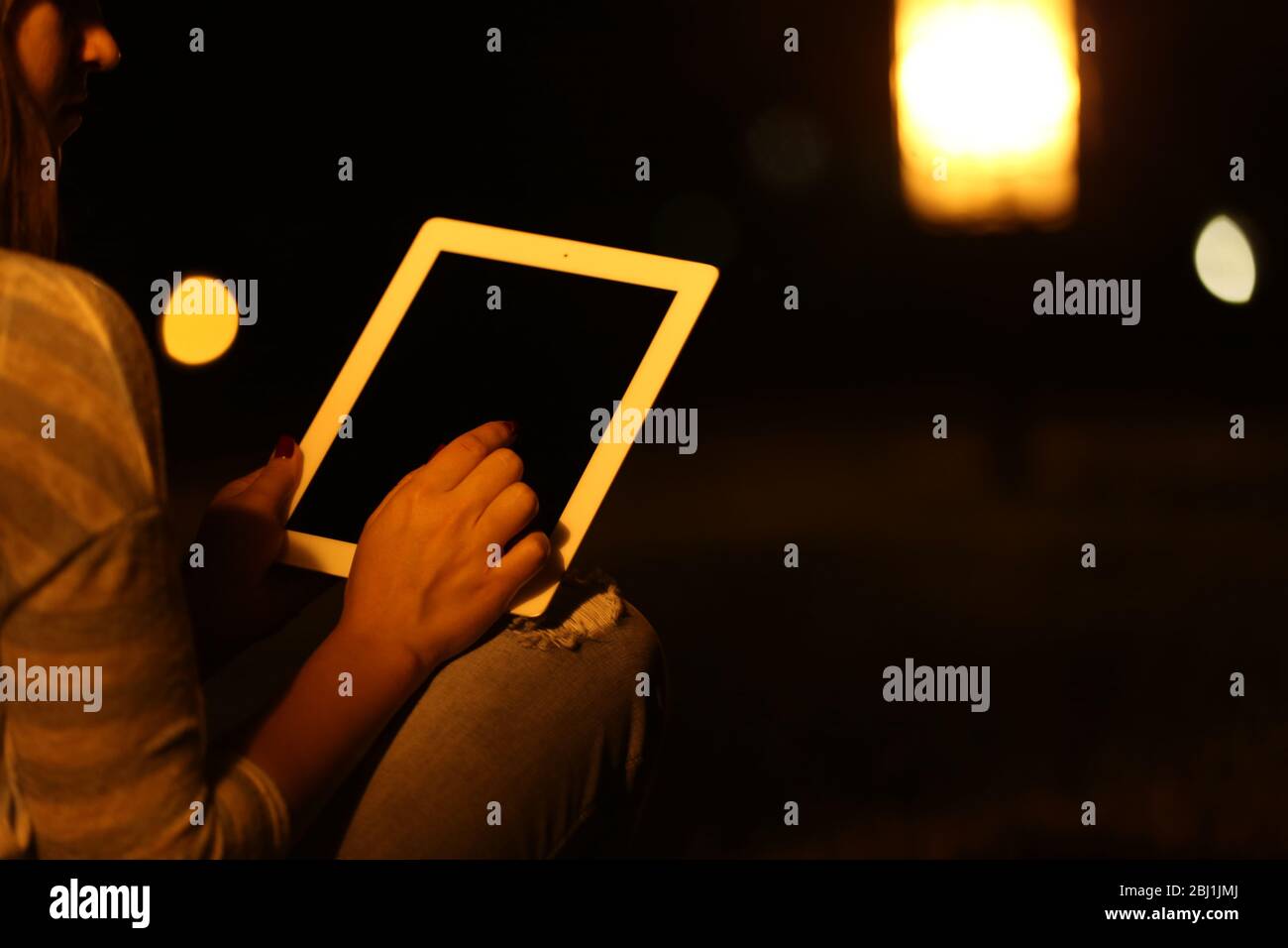 Woman using tablet at night people hi-res stock photography and images ...