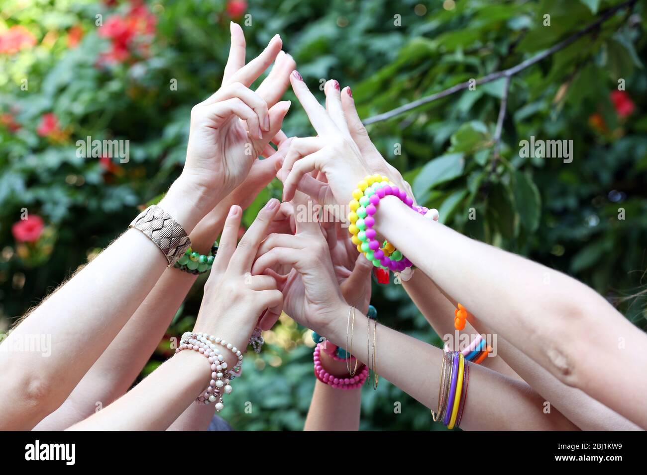 Group of young people hands outdoors Stock Photo - Alamy