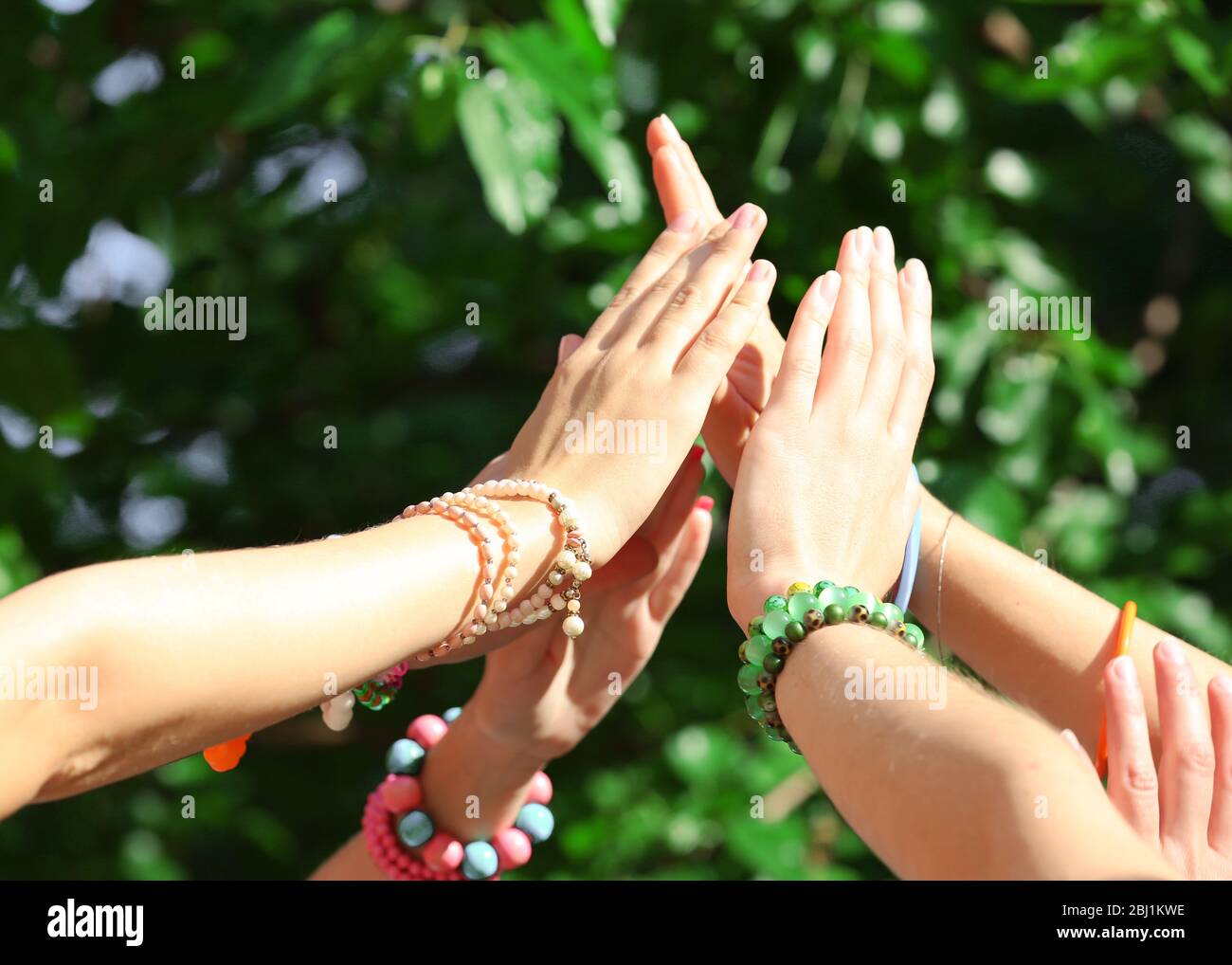 Group of young people hands outdoors Stock Photo - Alamy