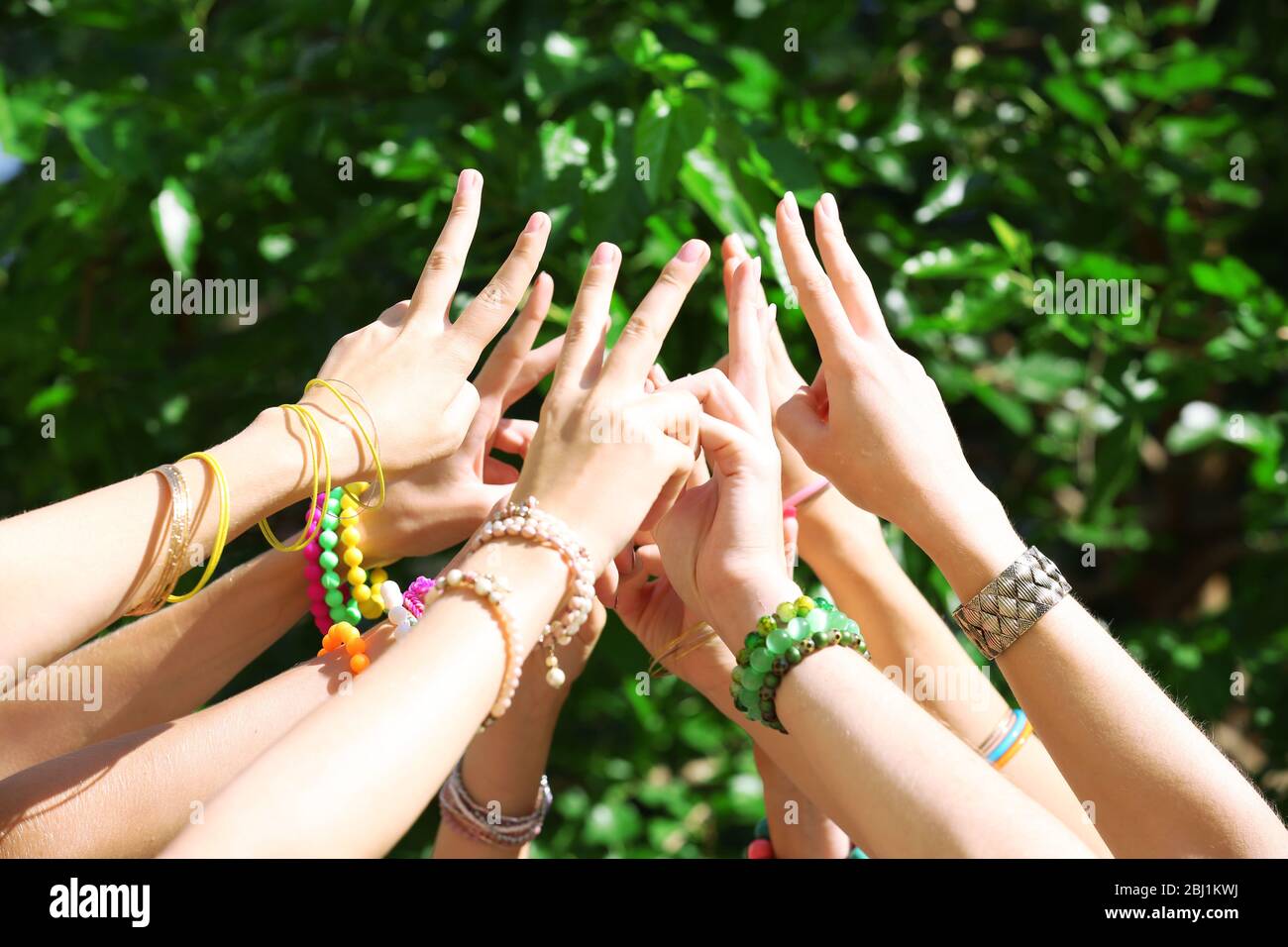 Group of young people hands outdoors Stock Photo - Alamy