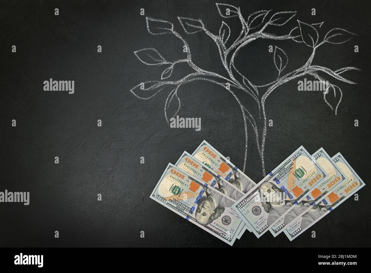 Money tree drawing on blackboard close up Stock Photo - Alamy