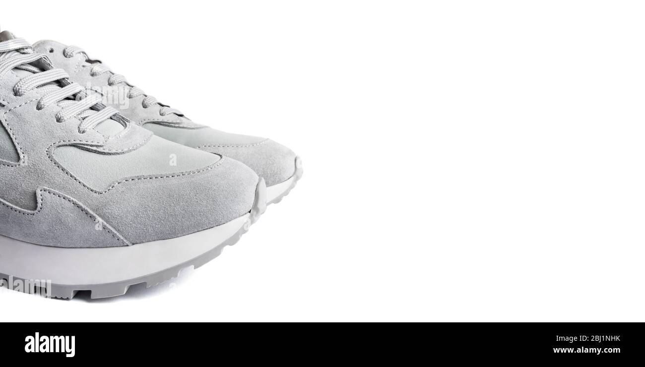 Gray sneakers isolated on white background Stock Photo - Alamy